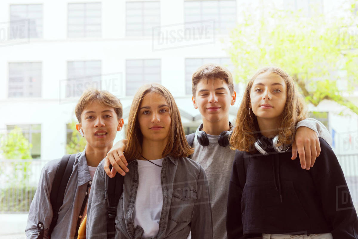 Friends standing outdoors - Royalty-free Stock Photo | Dissolve