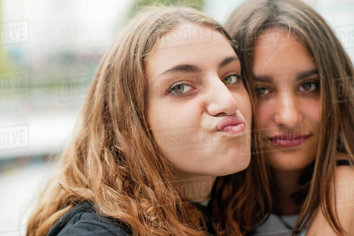 Friends embracing outdoors - Stock Photo - Dissolve