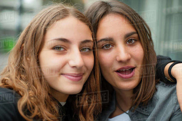 Close-up of smiling friends - Stock Photo - Dissolve