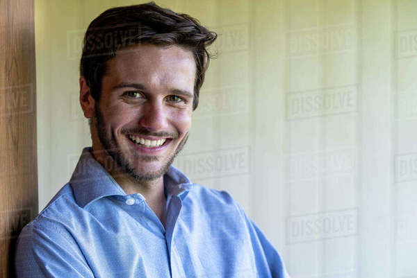 Portrait of young man standing in the house - Royalty-free Stock Photo ...