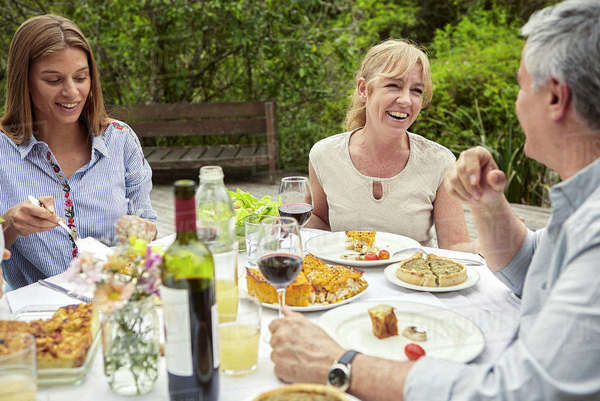 Happy family having meal - Royalty-free Stock Photo | Dissolve