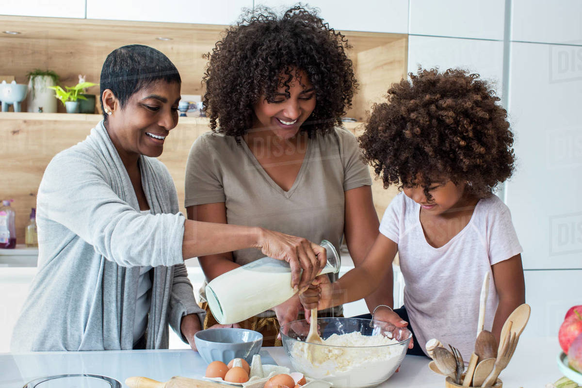Multi-generation family preparing cookies - Stock Photo - Dissolve