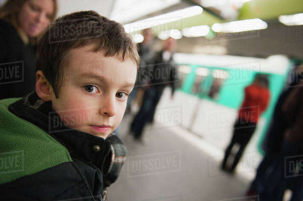 Boy waiting for train in subway station - Stock Photo - Dissolve
