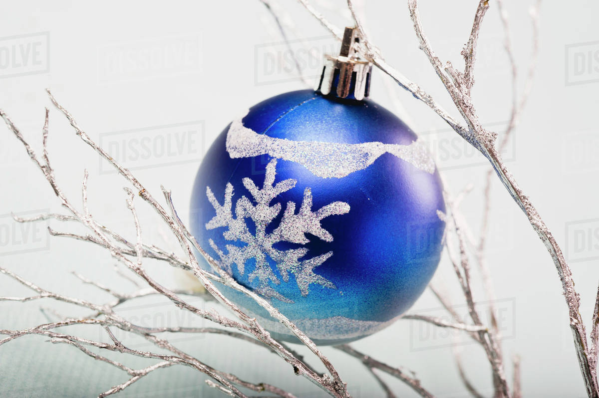 Blue bauble hanging from silver branches - Royalty-free Stock Photo ...