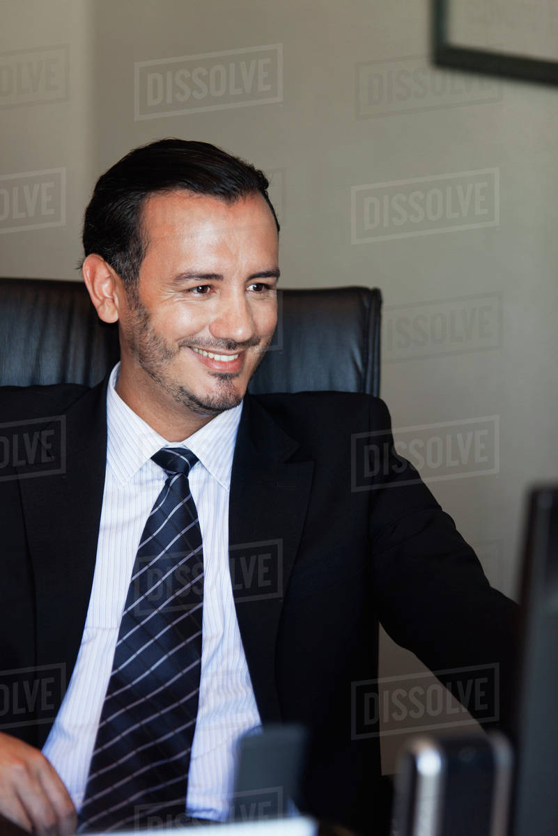 Mid-adult executive at work - Royalty-free Stock Photo | Dissolve