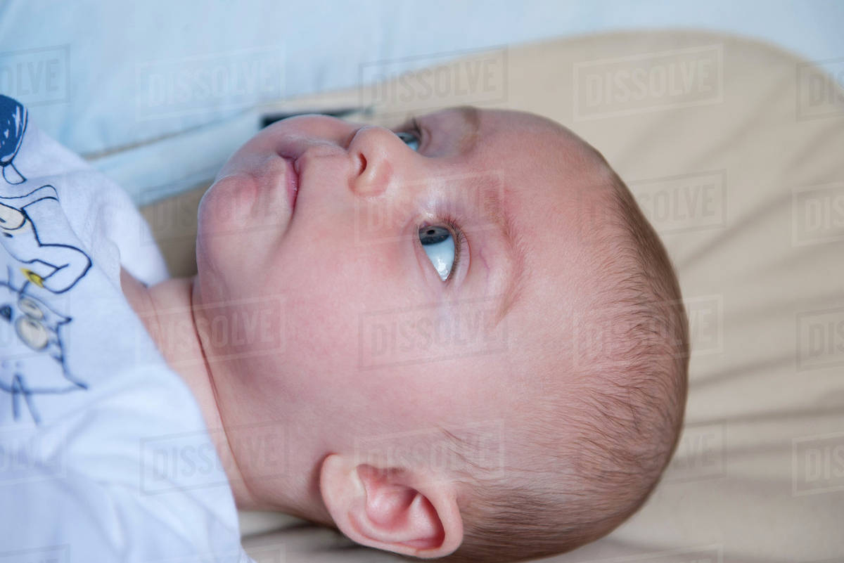 Baby lying on back - Royalty-free Stock Photo | Dissolve