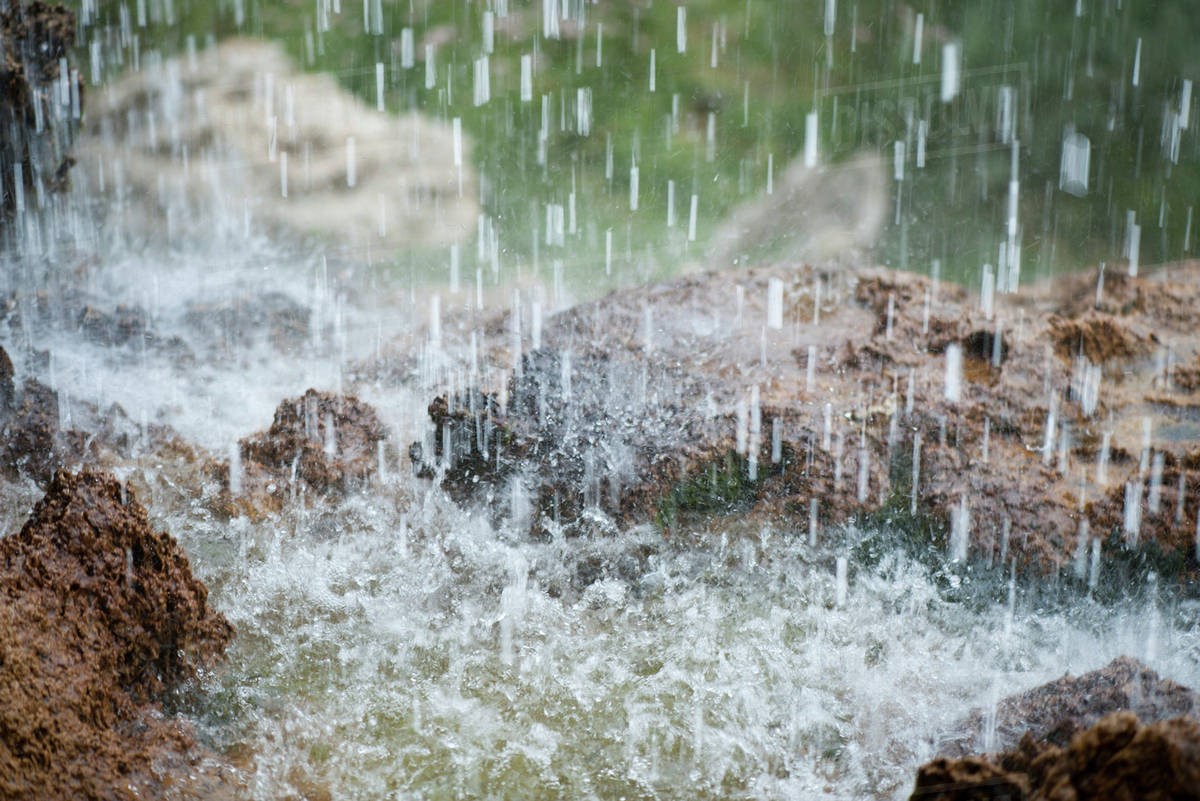 Water splashing on rocks - Stock Photo - Dissolve