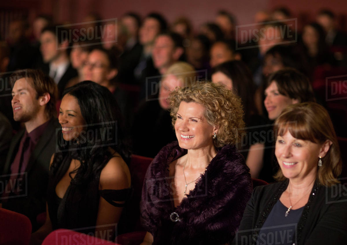 Smiling theater audience - Stock Photo - Dissolve