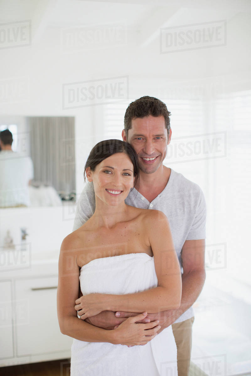 Couple hugging in bathroom - Royalty-free Stock Photo | Dissolve