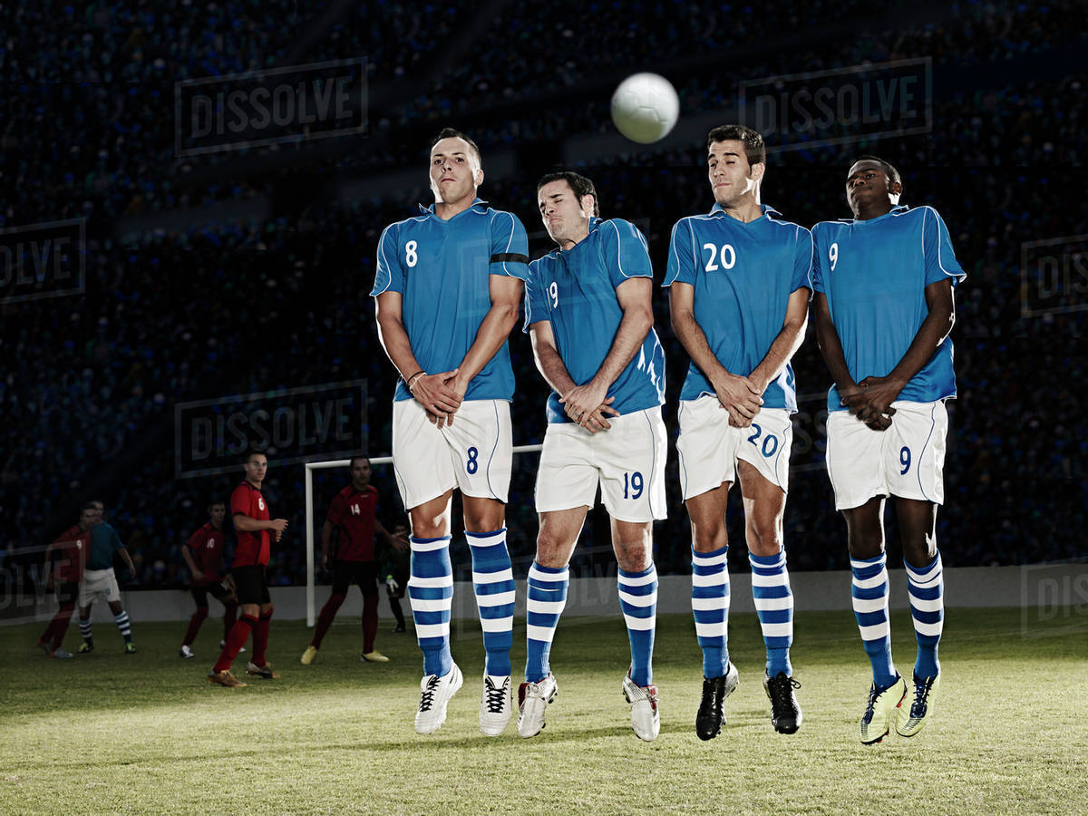Soccer players jumping on field - Royalty-free Stock Photo | Dissolve