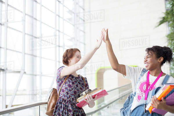 University students high fiving indoors - Royalty-free Stock Photo ...