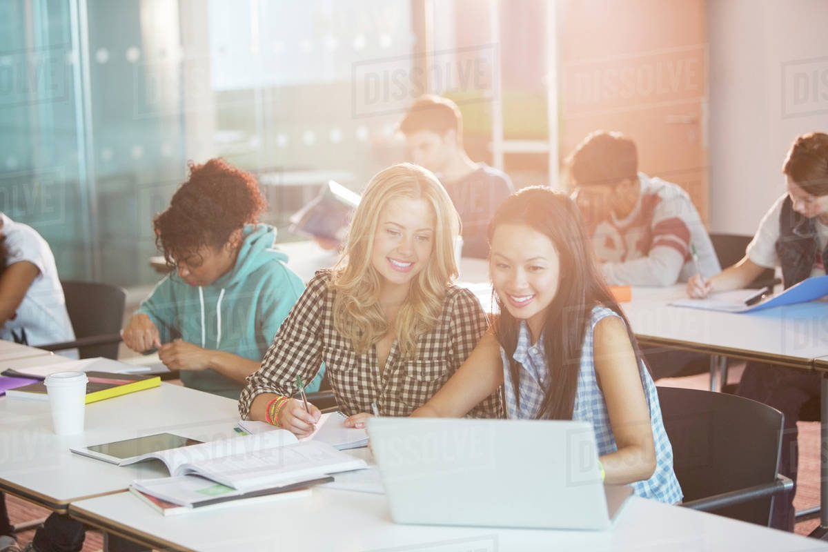 University students working in classroom - Stock Photo - Dissolve