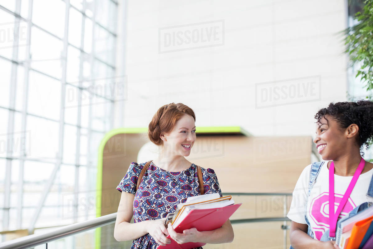 University students talking indoors - Stock Photo - Dissolve