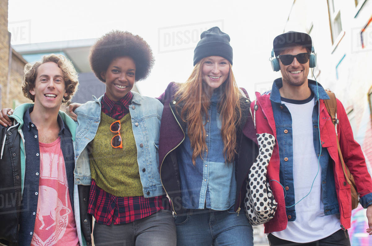 Friends walking together on city street - Royalty-free Stock Photo ...