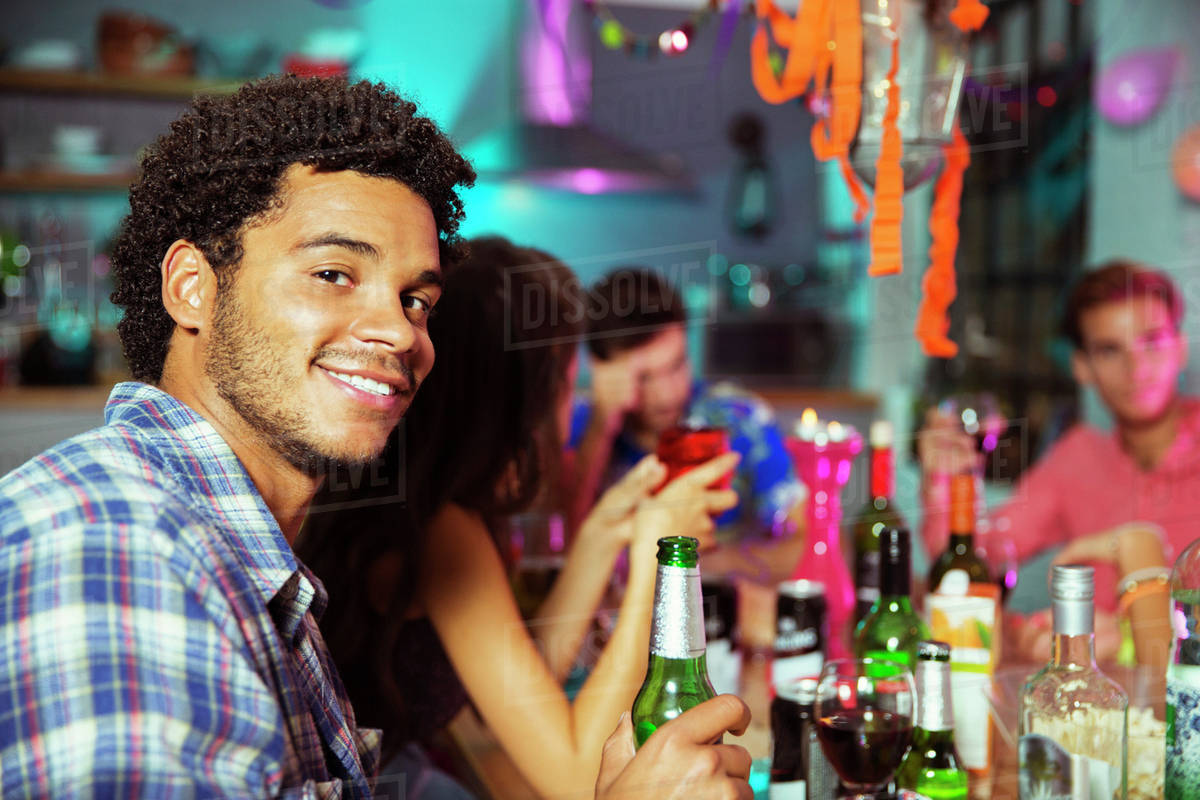 Man smiling at party - Royalty-free Stock Photo | Dissolve