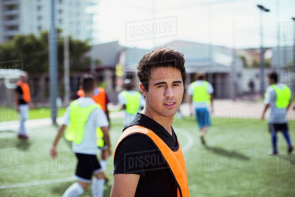 Soccer player smiling on field - Royalty-free Stock Photo | Dissolve