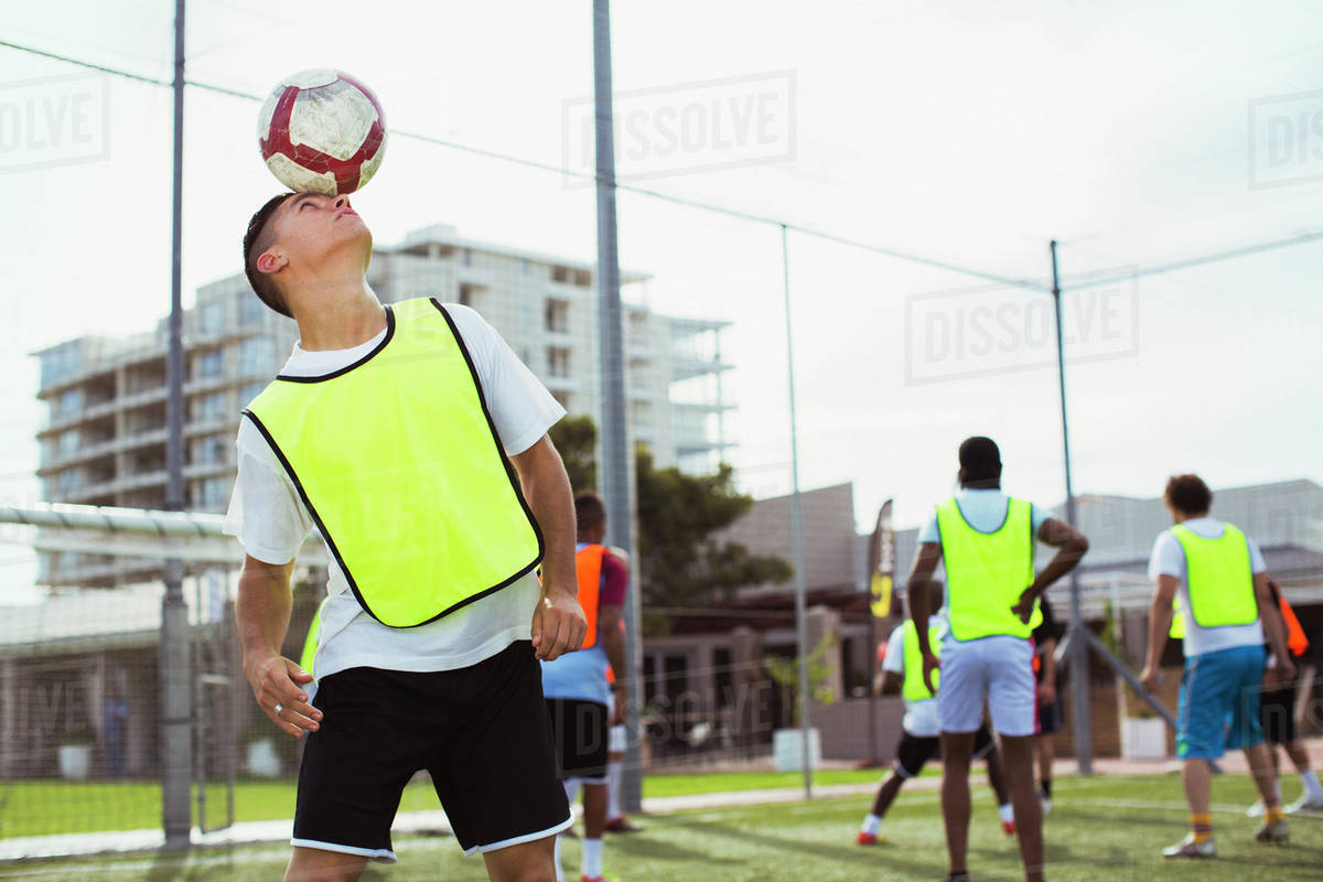 Soccer player training on field - Royalty-free Stock Photo | Dissolve