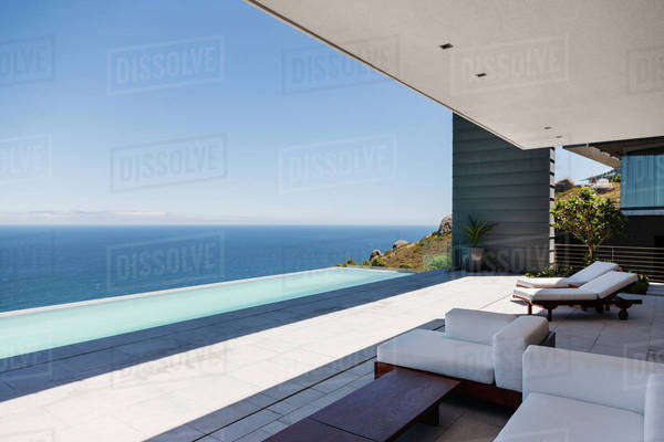 Modern patio overlooking ocean - Royalty-free Stock Photo | Dissolve