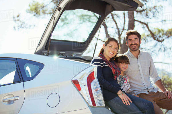 Portrait of happy family at back of car - Royalty-free Stock Photo ...