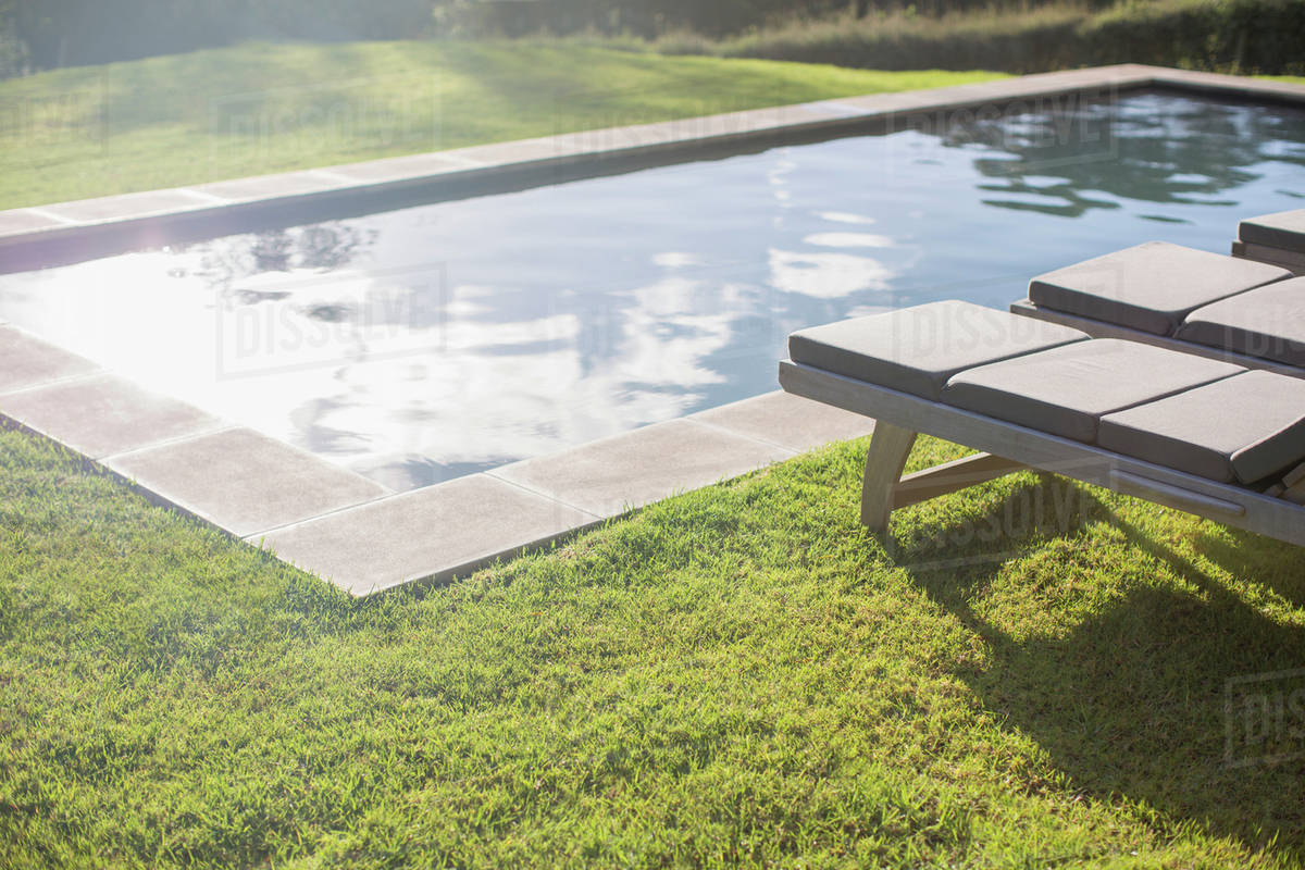 Sunny backyard with swimming pool - Royalty-free Stock Photo | Dissolve