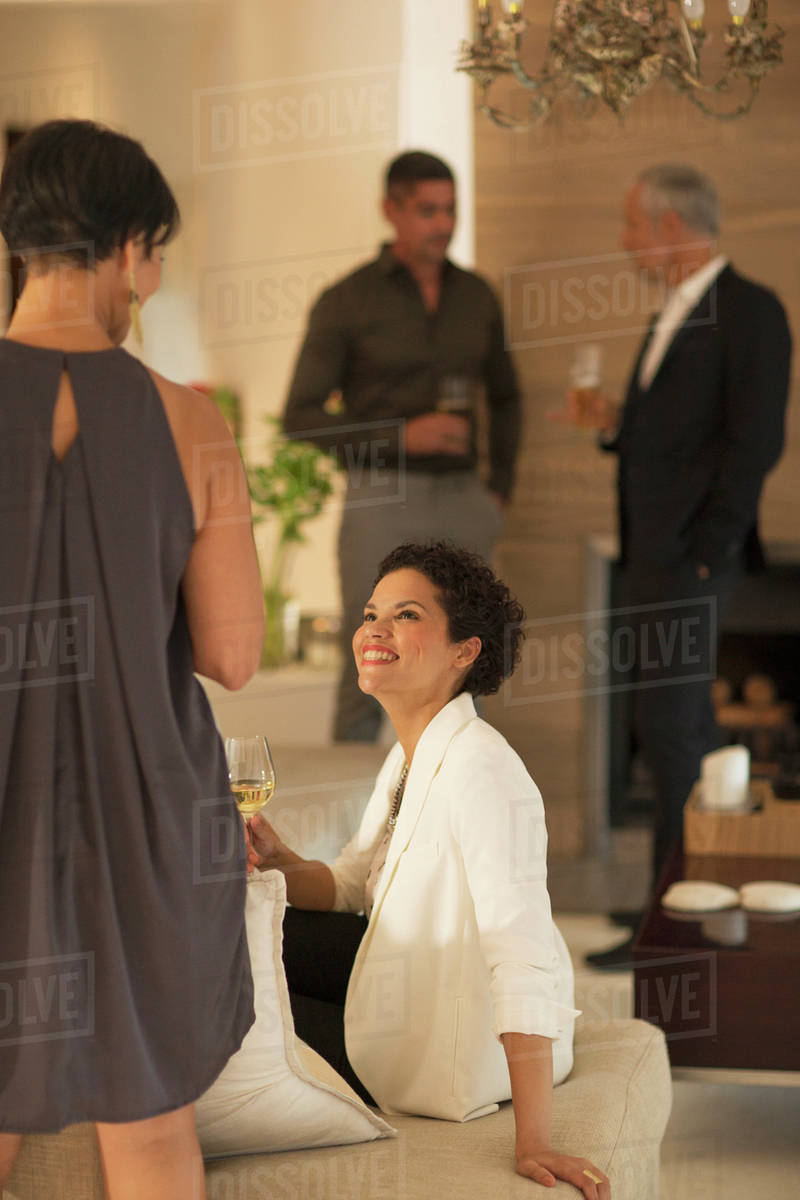 Women talking at party - Royalty-free Stock Photo | Dissolve