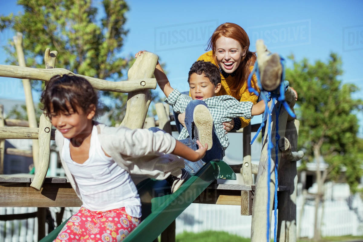Teacher and students playing on playground - Royalty-free Stock Photo ...
