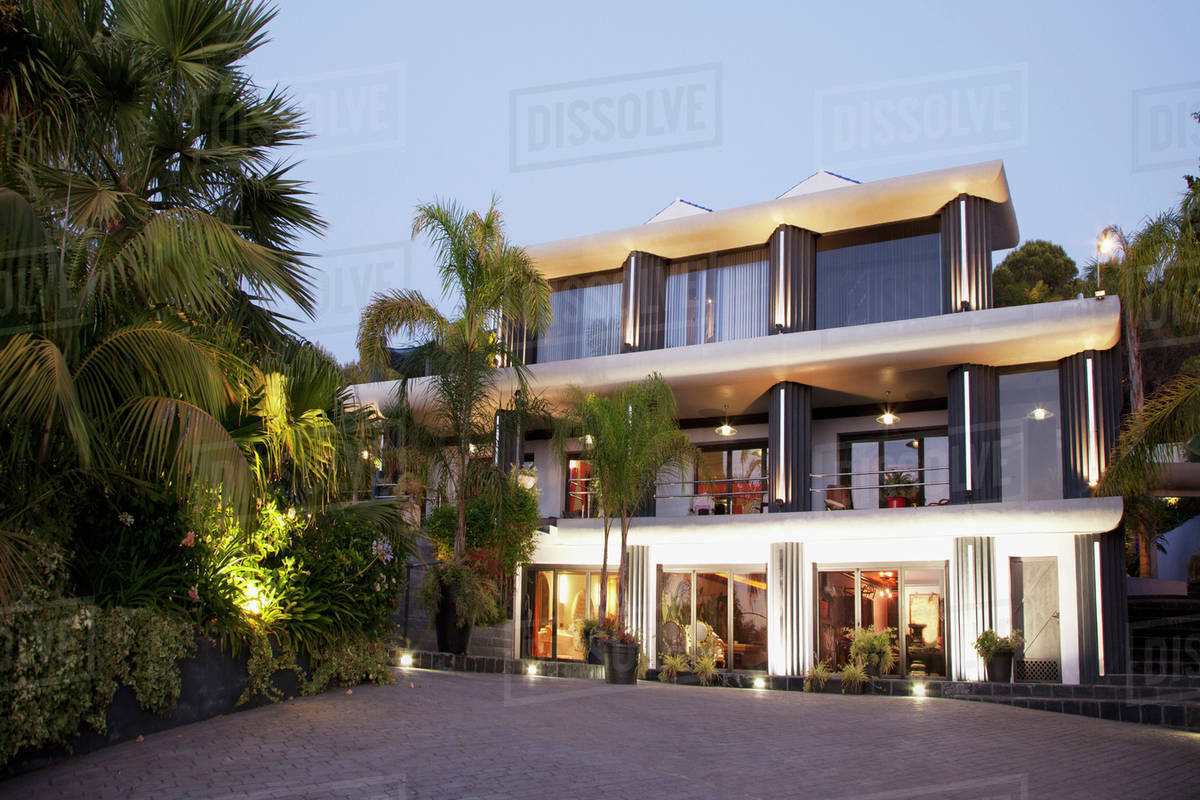 Luxury house illuminated at night - Royalty-free Stock Photo | Dissolve