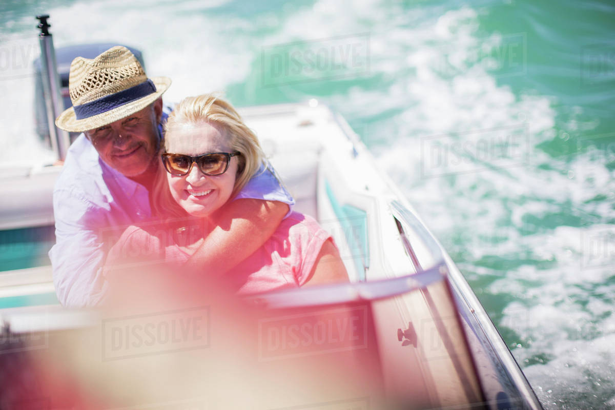 Couple sitting in boat together - Royalty-free Stock Photo | Dissolve