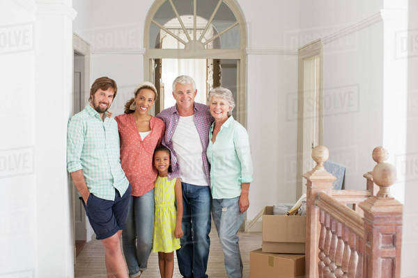 Family smiling together in living space - Royalty-free Stock Photo ...