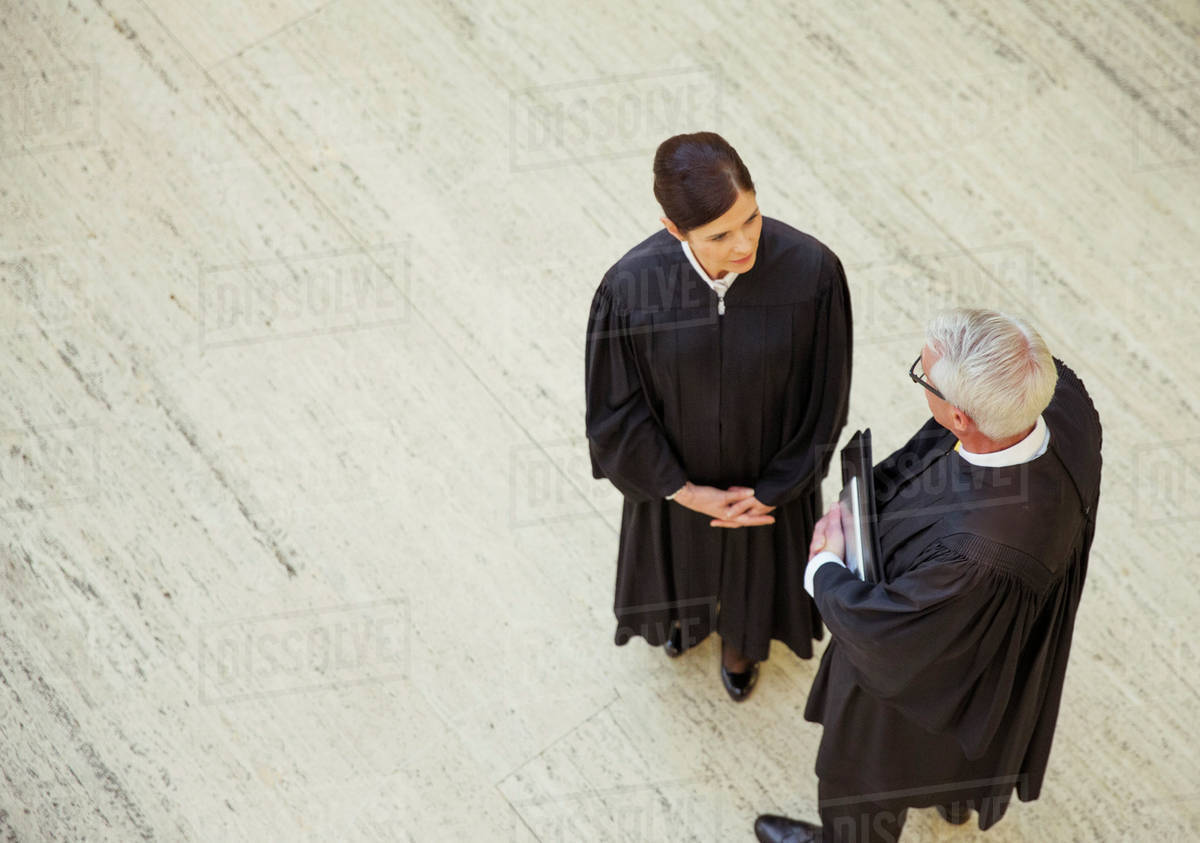 Judges talking in courthouse - Royalty-free Stock Photo | Dissolve