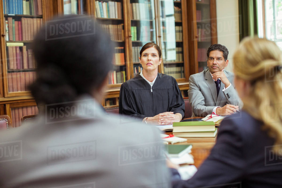 Judge and lawyers talking in chambers - Royalty-free Stock Photo | Dissolve