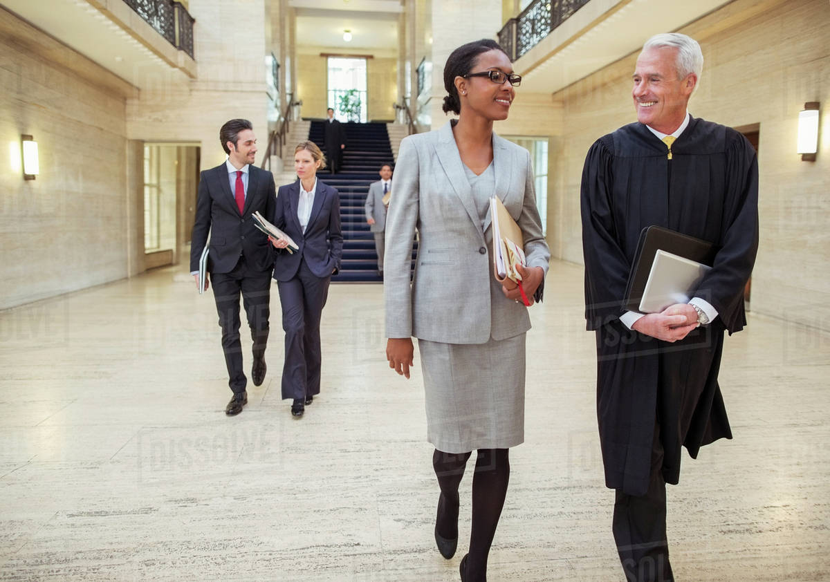 Judges and lawyers walking through courthouse - Royalty-free Stock ...