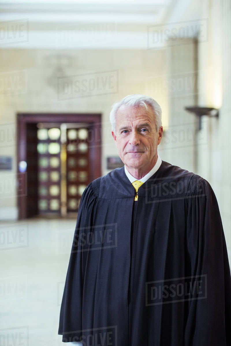 Judge smiling in courthouse - Royalty-free Stock Photo | Dissolve
