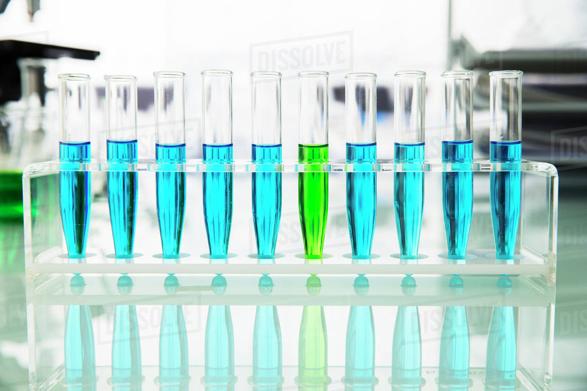 Rack of test tubes with solution on counter in lab - Royalty-free Stock ...