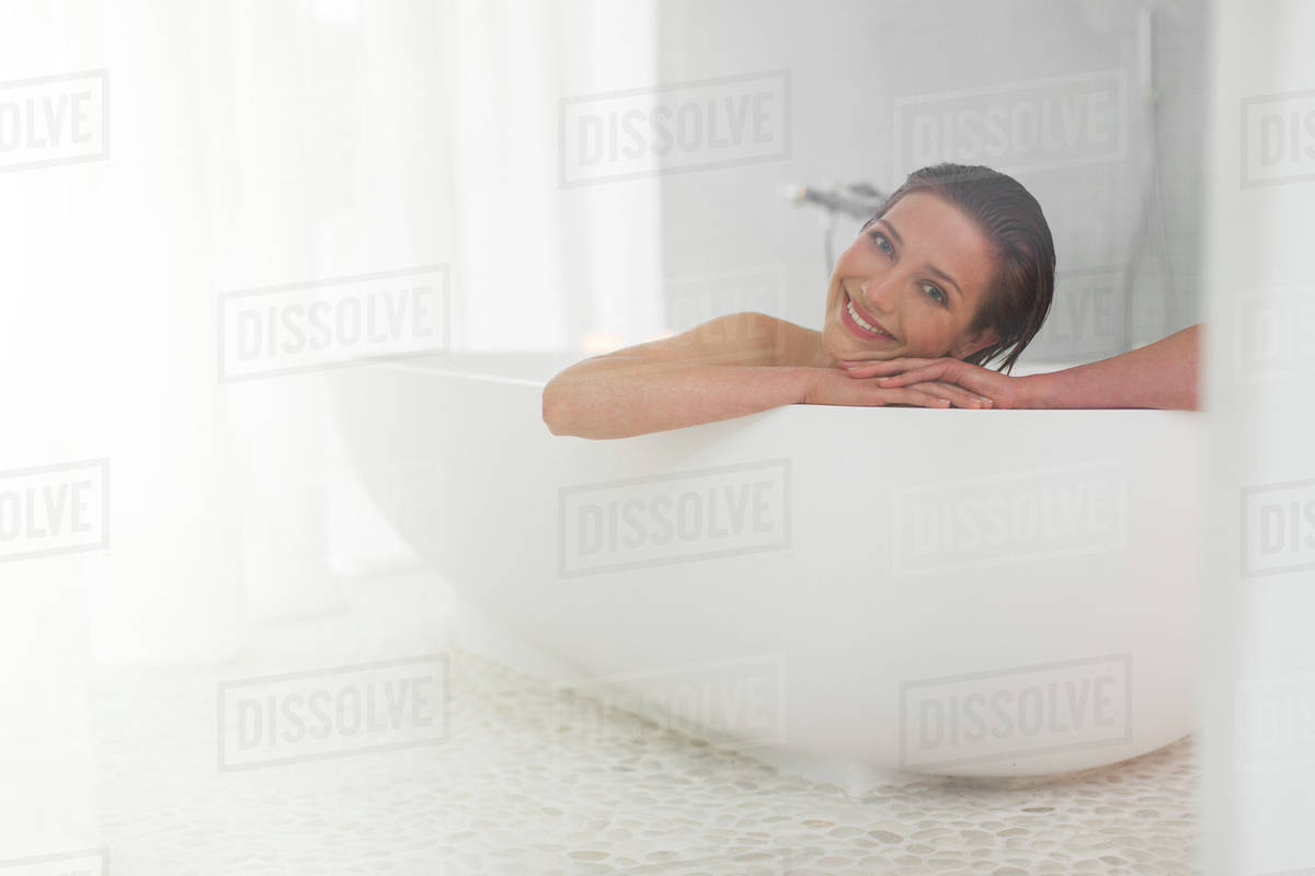Smiling woman taking bath in modern bathroom - Royalty-free Stock Photo ...