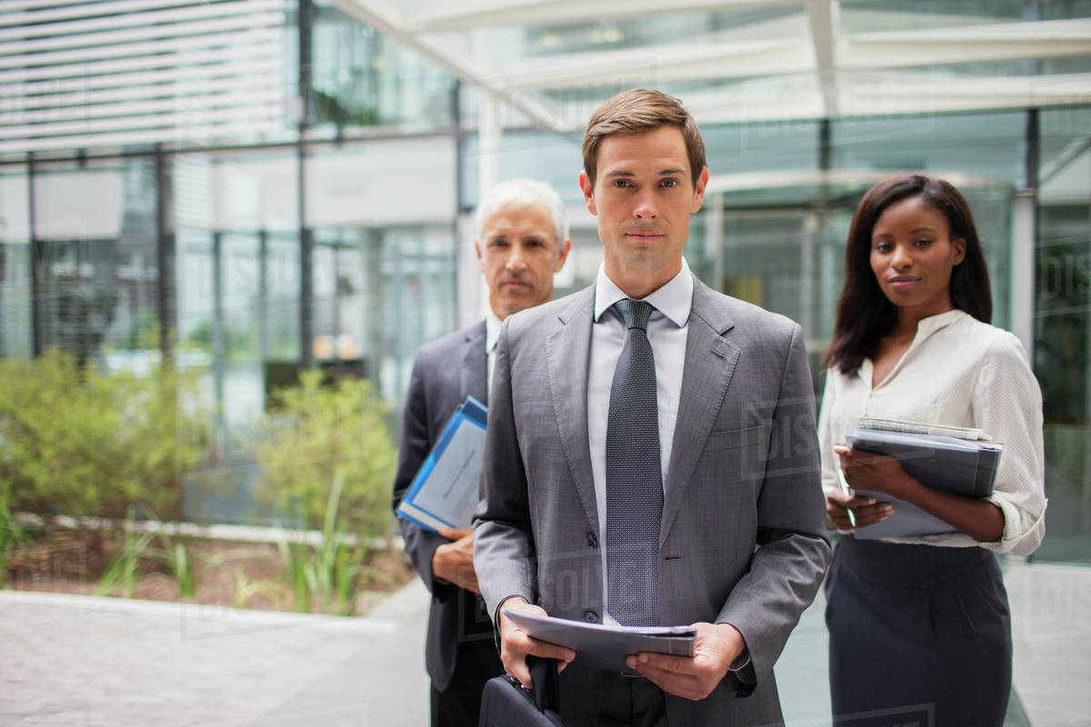 Business people outside of office building - Stock Photo - Dissolve