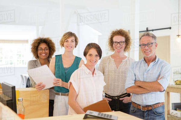 Portrait of smiling office workers - Royalty-free Stock Photo | Dissolve