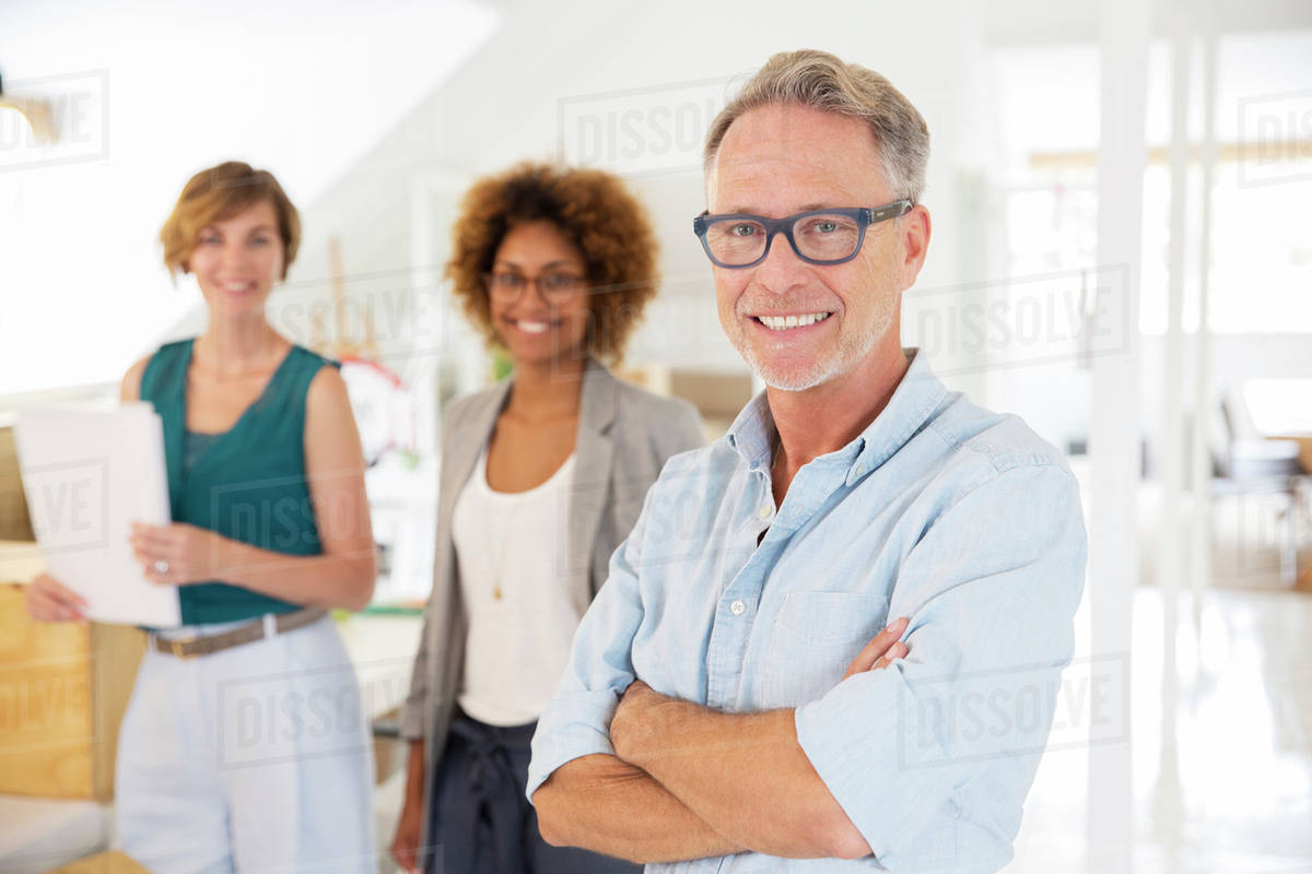 Portrait of smiling office workers - Stock Photo - Dissolve
