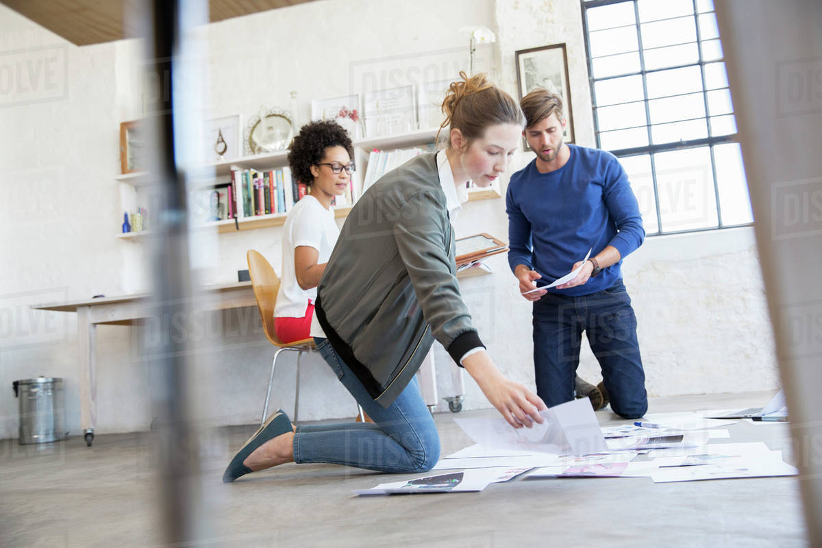 Three young people working together in studio - Royalty-free Stock ...