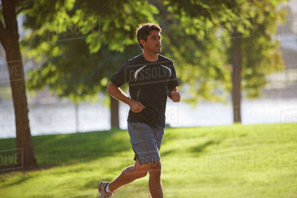 Man jogging in park - Stock Photo - Dissolve