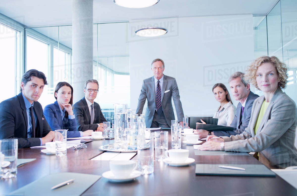 Business people sitting in meeting - Stock Photo - Dissolve