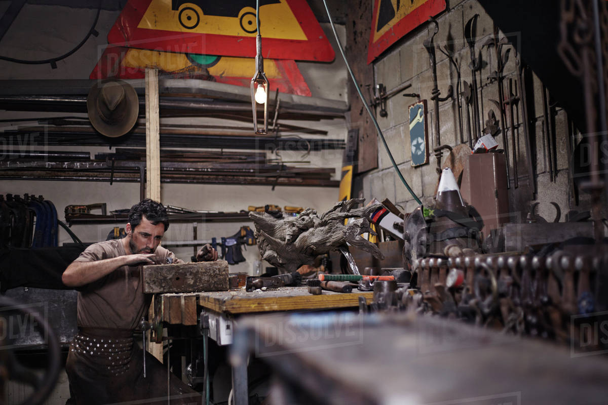 Blacksmith working in forge - Royalty-free Stock Photo | Dissolve