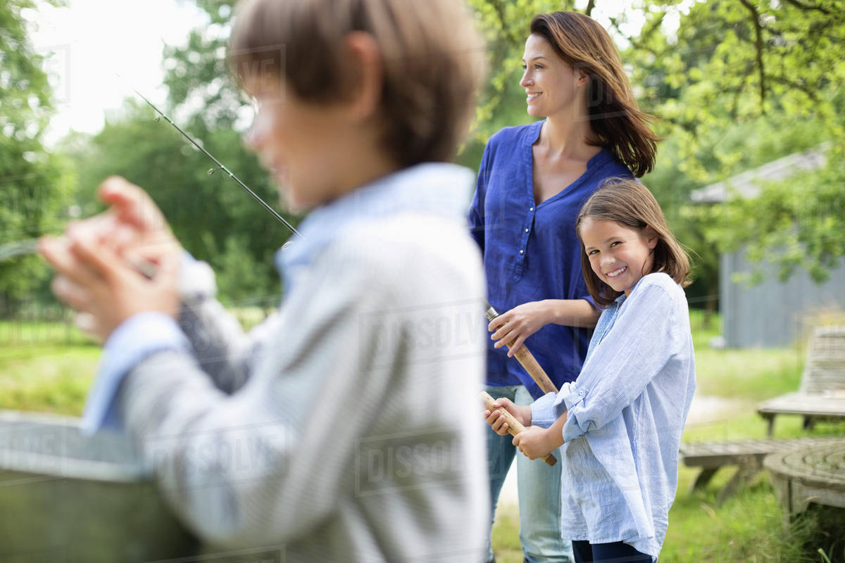 Family fishing together - Stock Photo - Dissolve