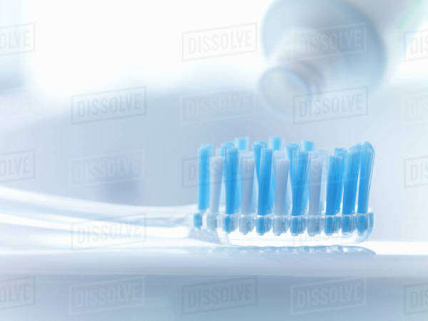 Close-up of toothbrush and toothpaste - Royalty-free Stock Photo | Dissolve