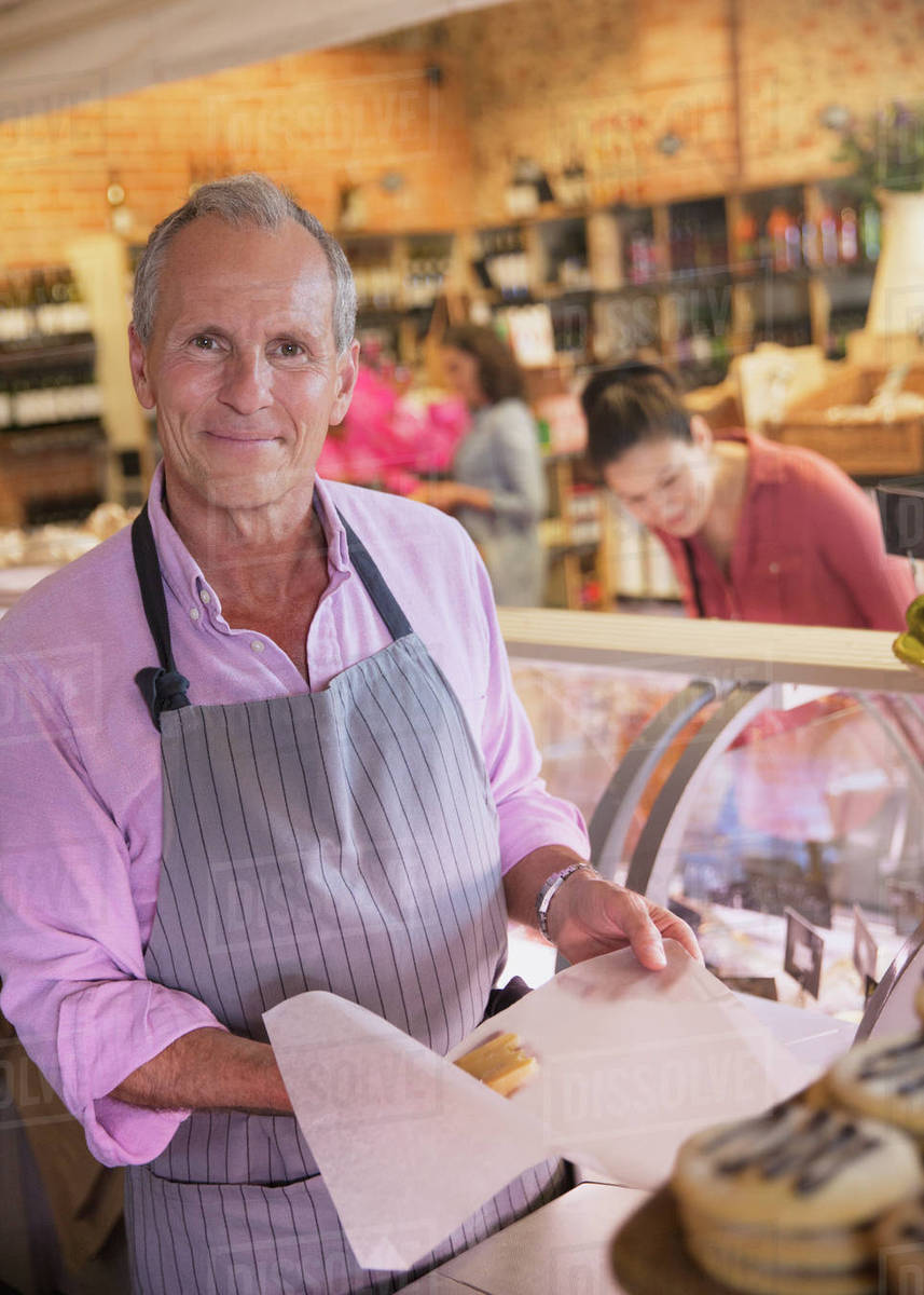 Portrait smiling deli worker in grocery store - Royalty-free Stock ...