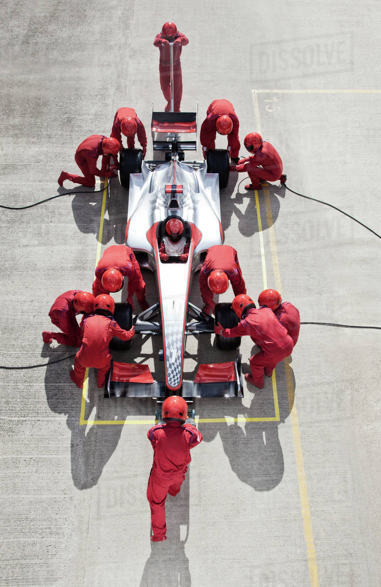 Racing team working at pit stop - Royalty-free Stock Photo | Dissolve