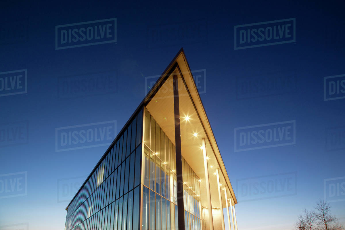 Modern building illuminated at dusk - Royalty-free Stock Photo | Dissolve
