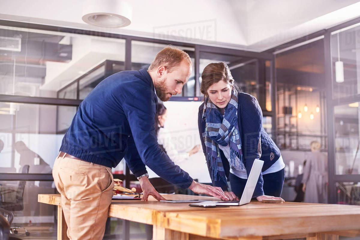 Business people using laptop in conference room meeting - Royalty-free ...