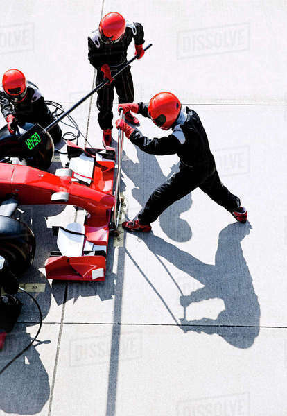 Overhead pit crew with hydraulic lift in pit lane - Royalty-free Stock ...