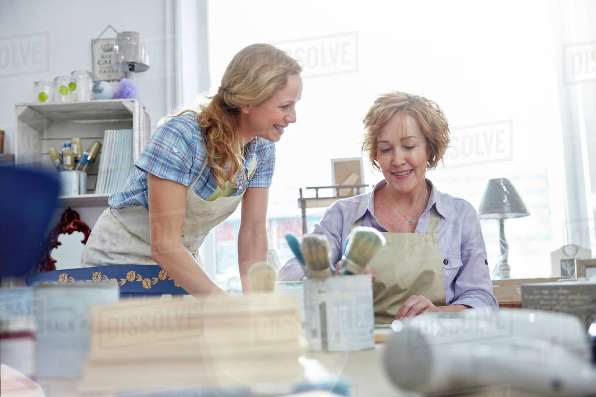 Smiling female artists painting in art class workshop - Royalty-free ...